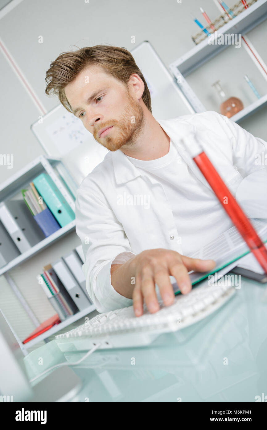 chemist doing a computer representation of the experiment Stock Photo ...