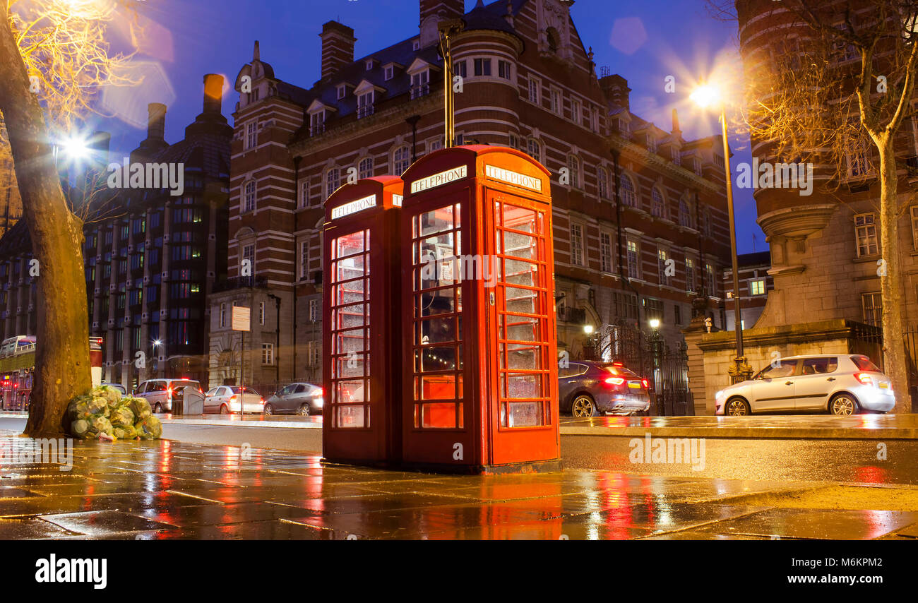 old telephone cabins in London city. Night scene Stock Photo - Alamy