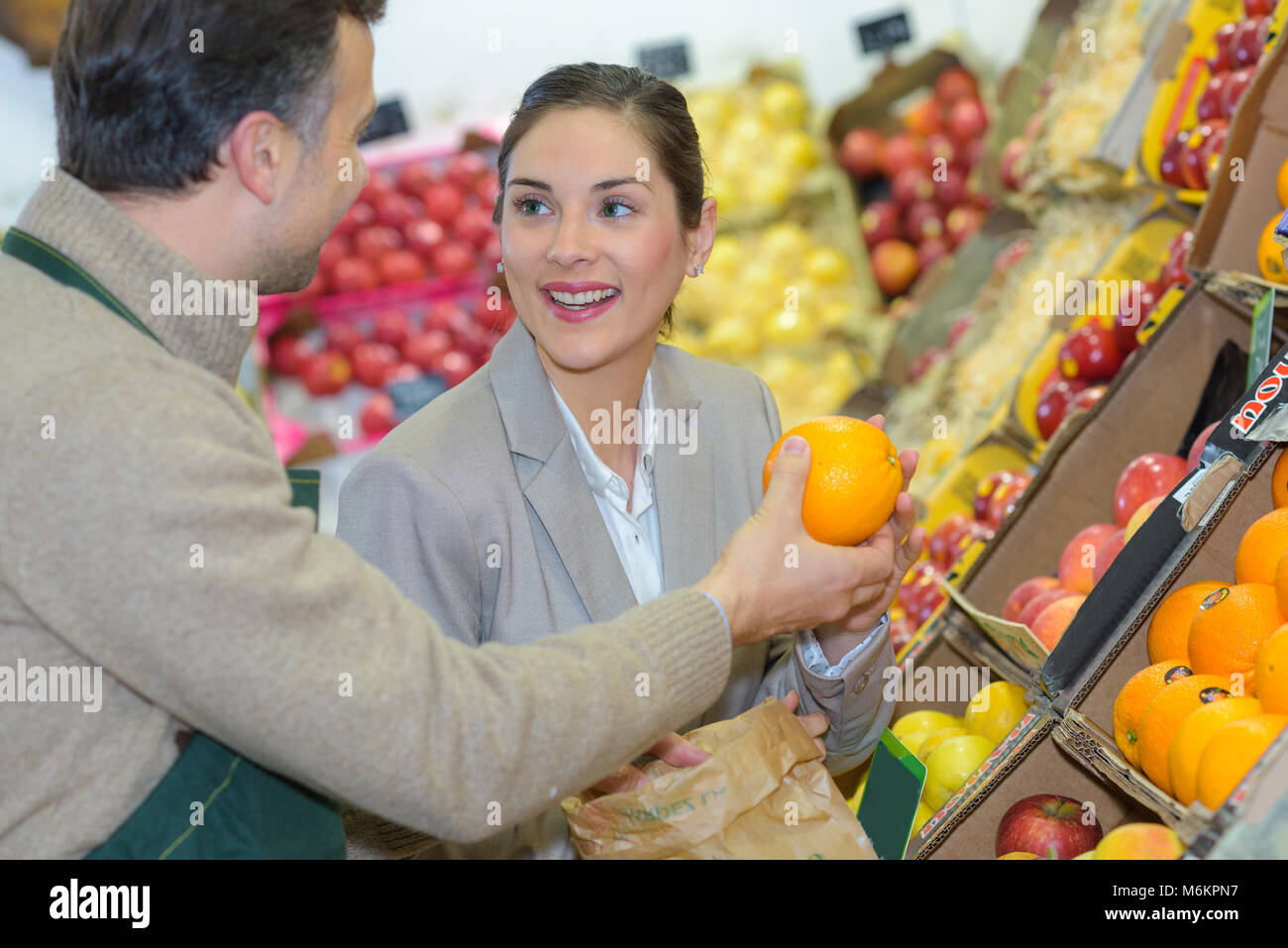 buying some oranges Stock Photo - Alamy
