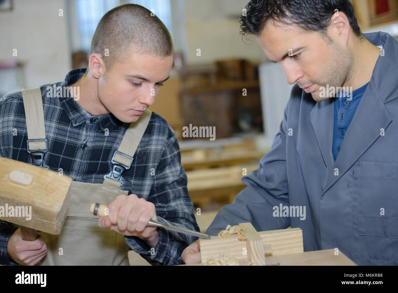 young man carving the wood Stock Photo - Alamy