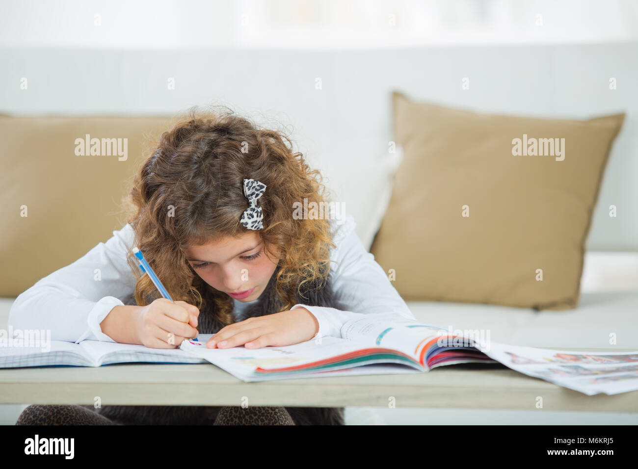 cute girl doing homework for school Stock Photo - Alamy