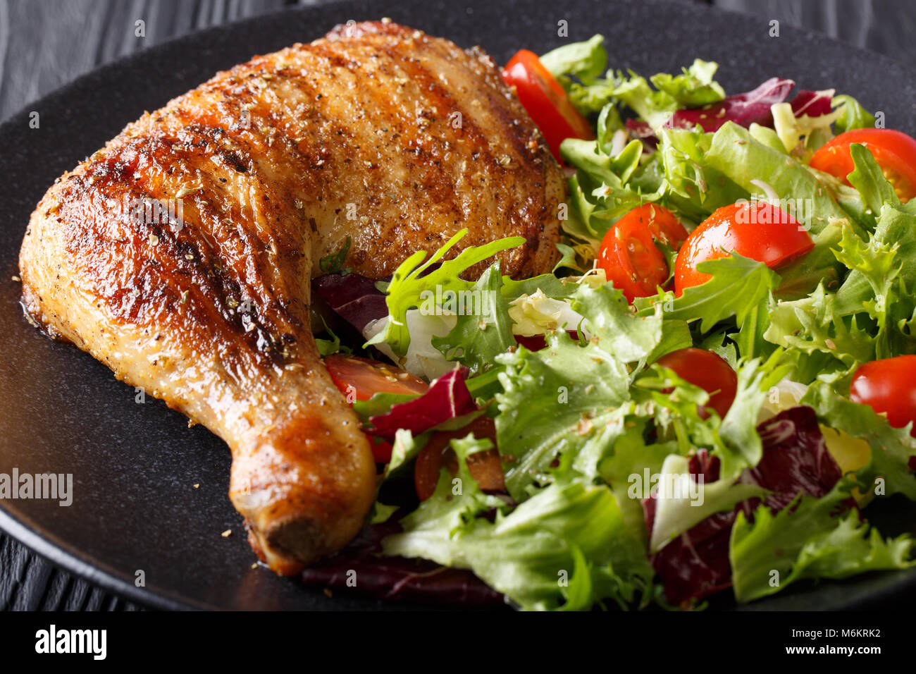 Grilled Chicken Leg With Fresh Vegetable Salad Close Up On A Plate