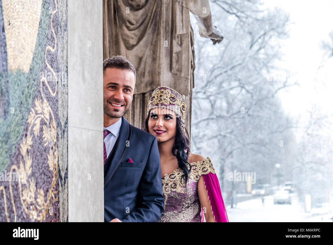 Happy couple in traditional turkish wedding dress during their wedding ...