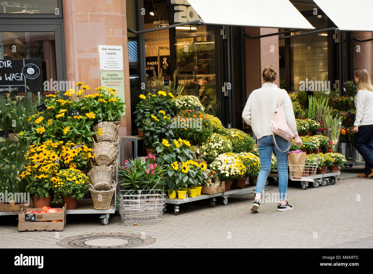 German women people looking and buy flower at Flower shop in ...