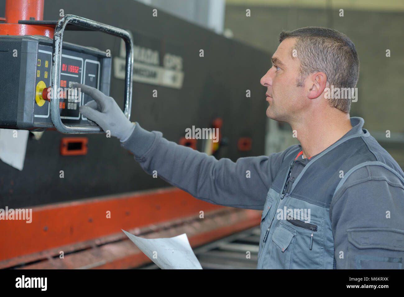 operating a machine Stock Photo - Alamy