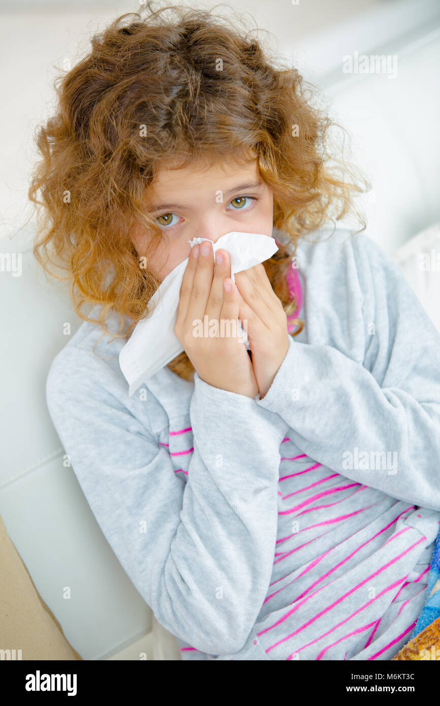 girl with covering her nose with napkin Stock Photo - Alamy