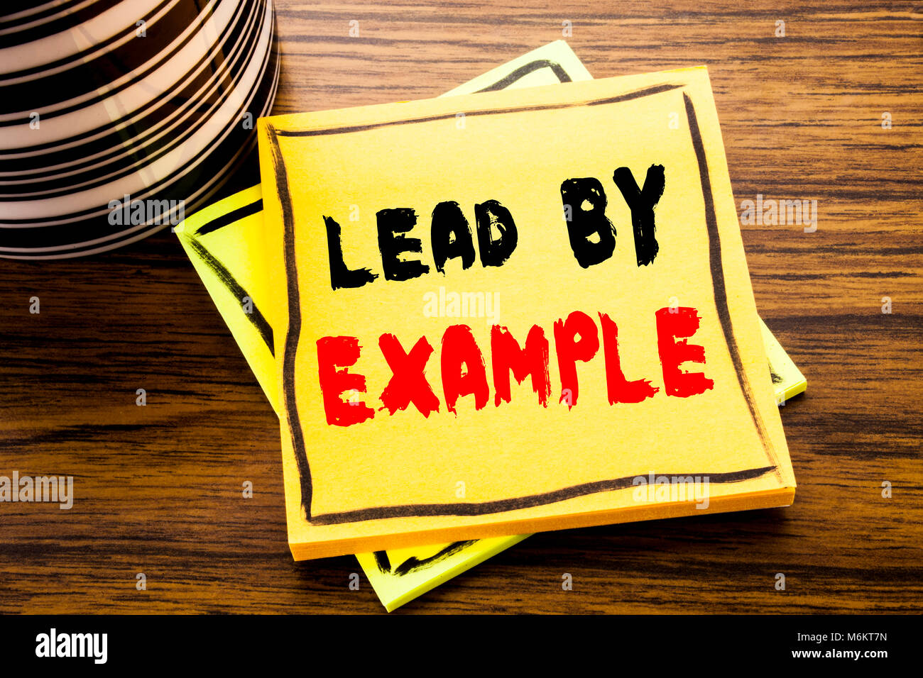 Handwriting Announcement text showing Lead By Example. Business concept ...