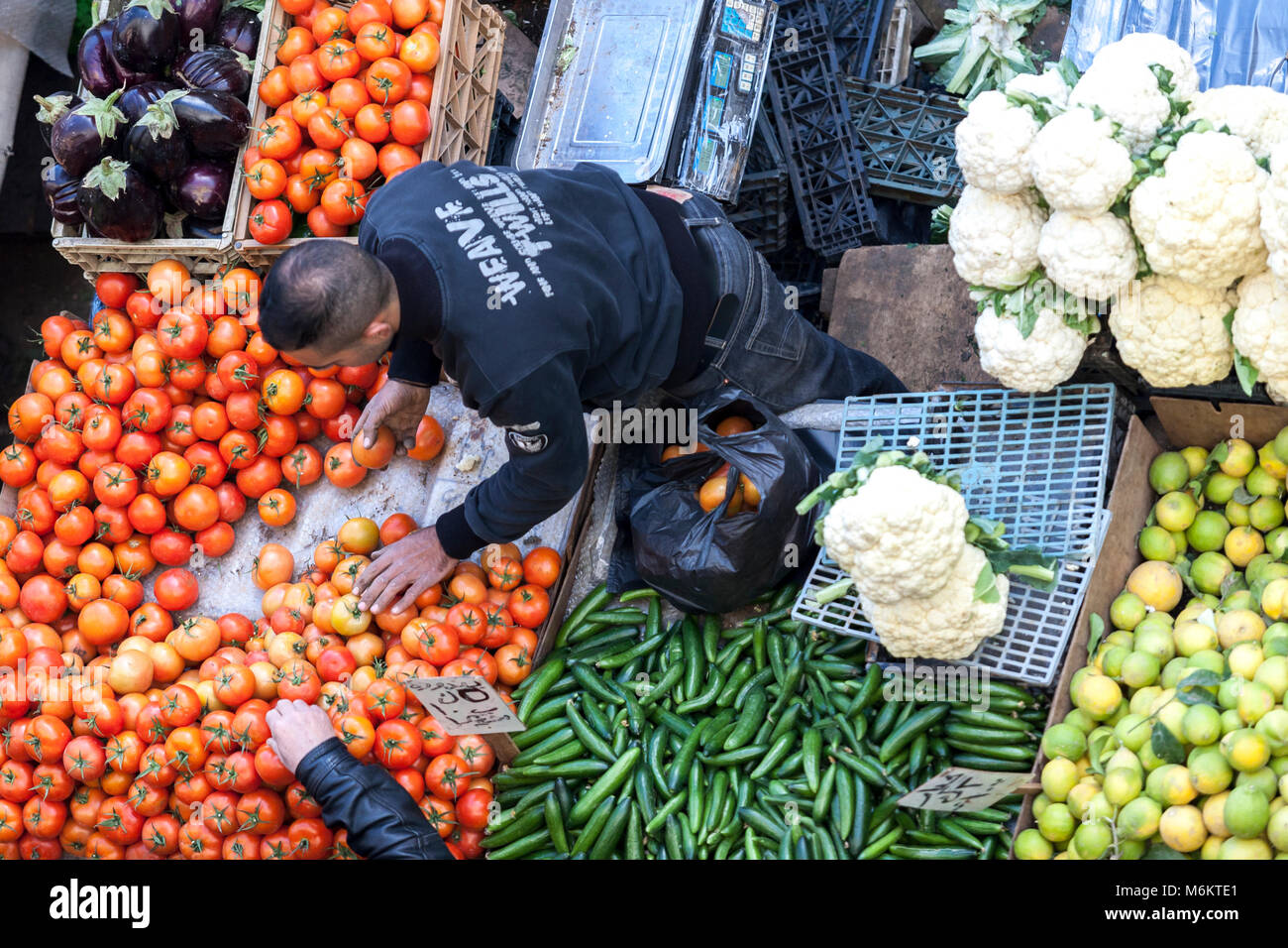 Ramallah, Palestine, January 12, 2011: A man selling fresh fruits and ...