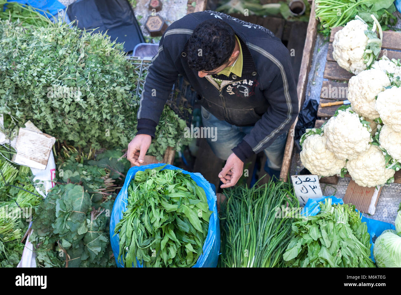 Ramallah, Palestine, January 12, 2011: A man selling fresh fruits and ...