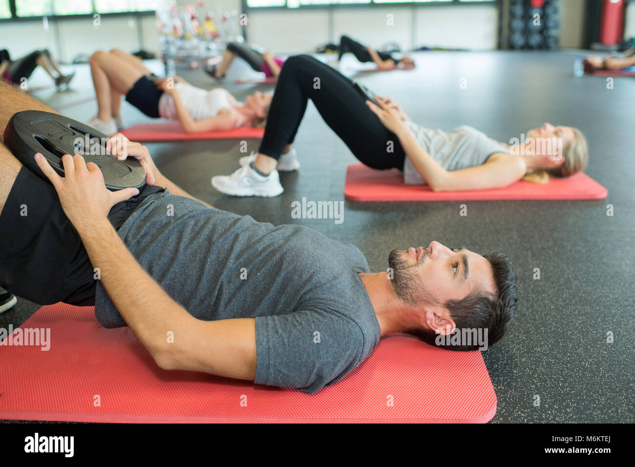 group people exercising on floor of gym club Stock Photo - Alamy