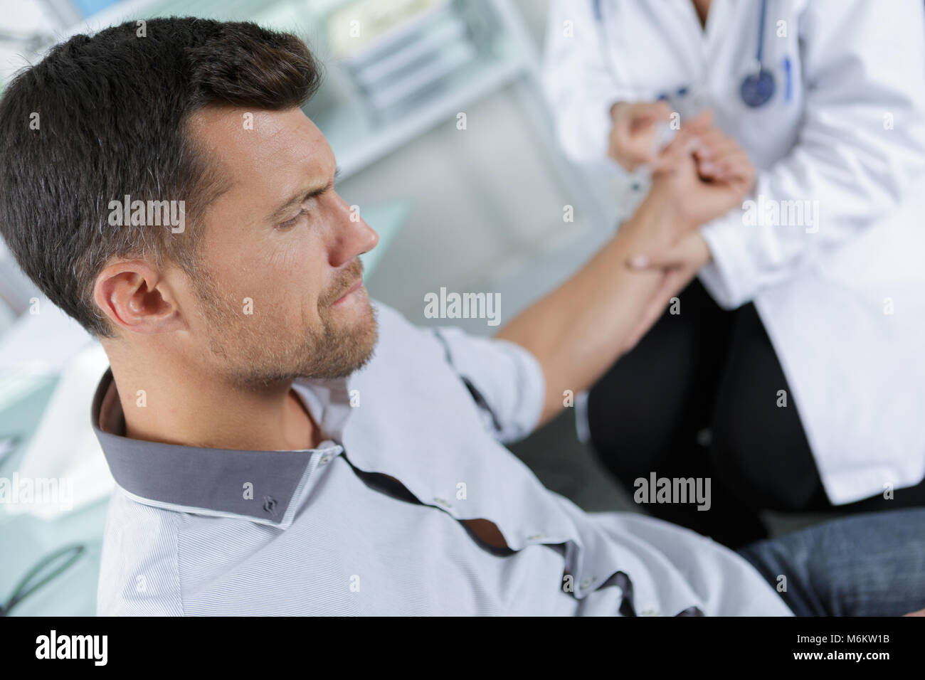 patient scared by syringe during blood collection Stock Photo - Alamy