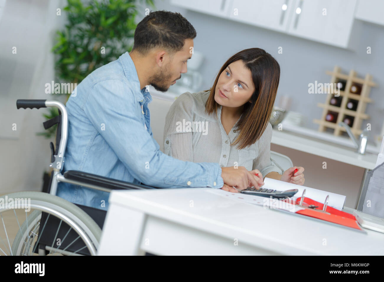 disabled man at home with girlfriend Stock Photo - Alamy