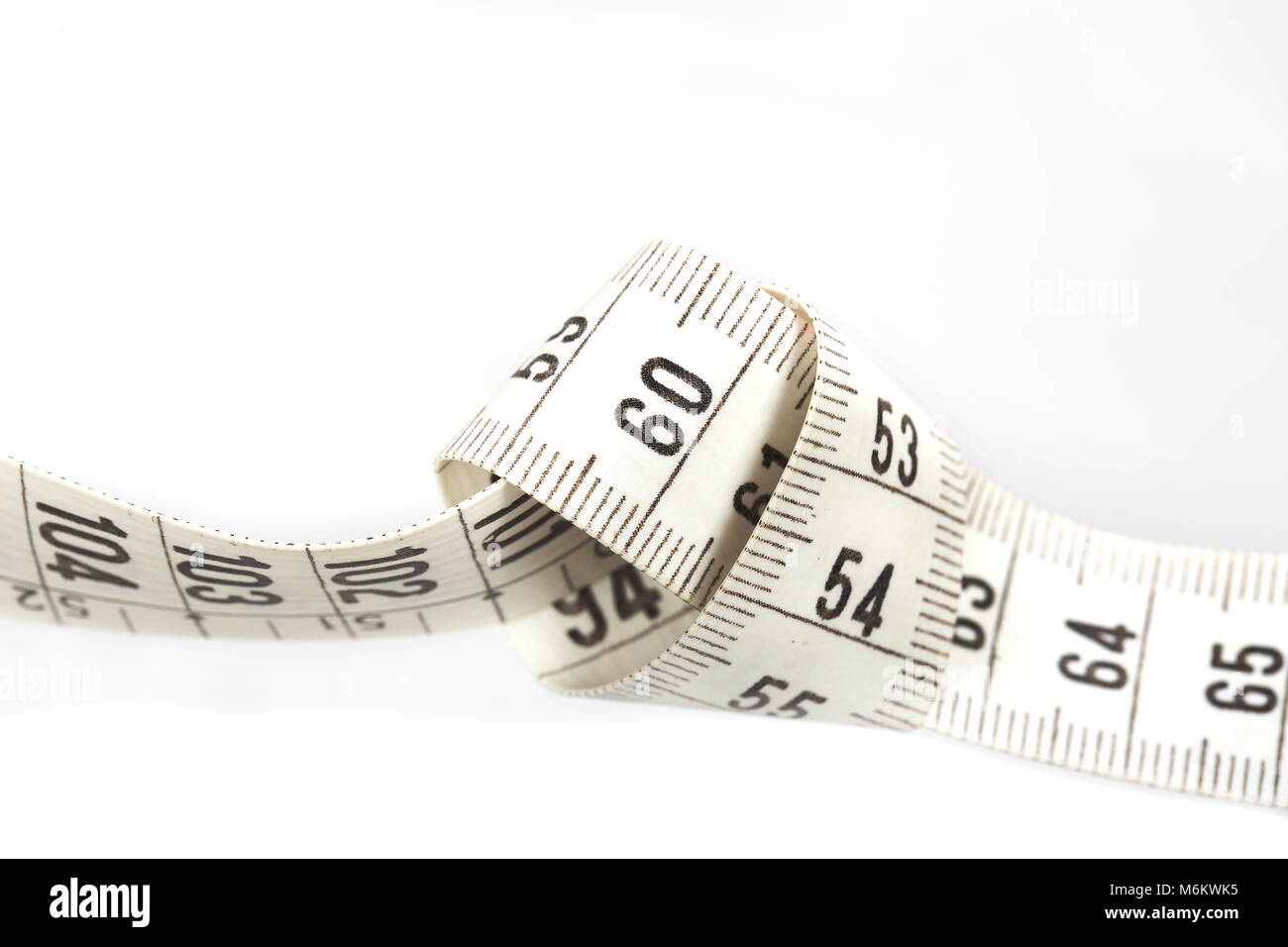 Knot done from measuring band. Closeup Stock Photo - Alamy