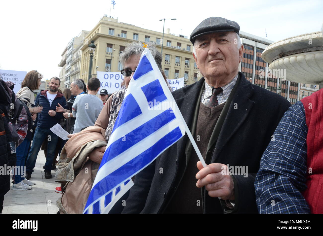 Athens, Greece. 04th Mar, 2018. A demonstrator holds a Greek flag ...