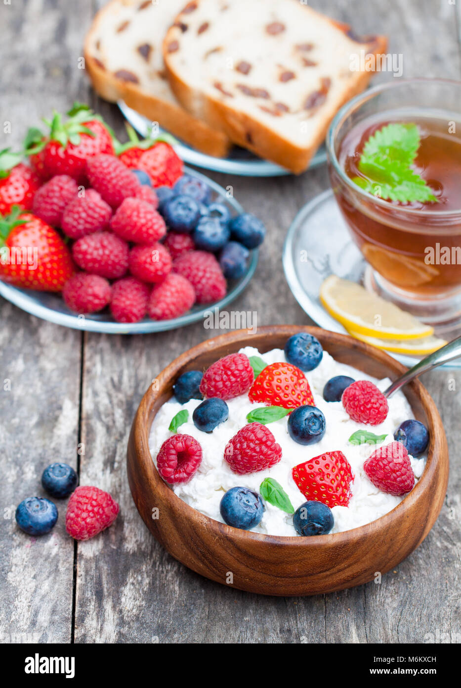 healthy breakfast cottage cheese with berries and melissa tea Stock ...