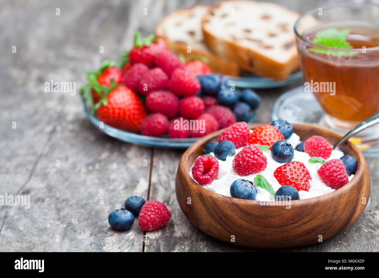 healthy breakfast cottage cheese with berries and melissa tea Stock ...