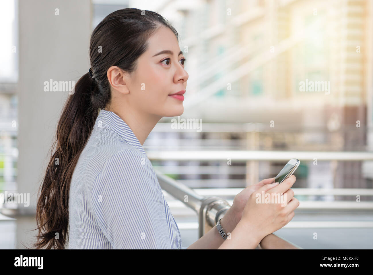 beautiful girl using looking out of future vision and holding a ...