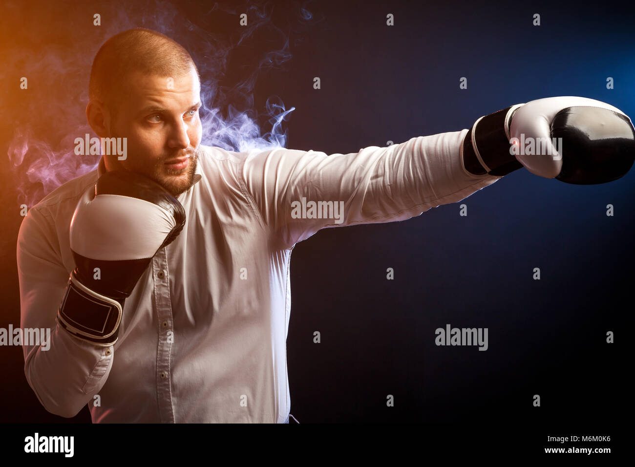 Handsome young man businessman in white shirt and black and white ...