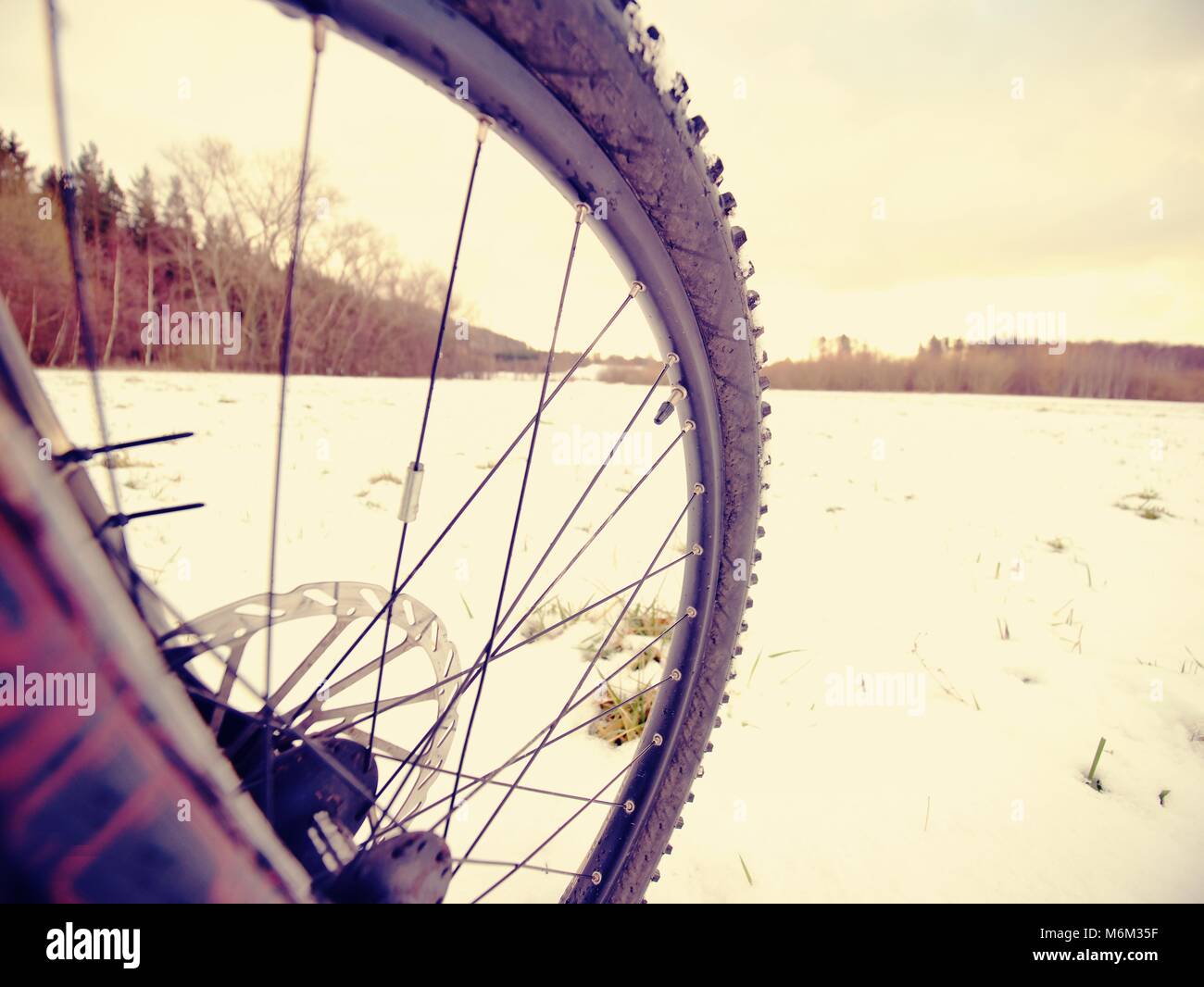 Winter snow riding on mountine bike. Extreme weather, slippery road in ...