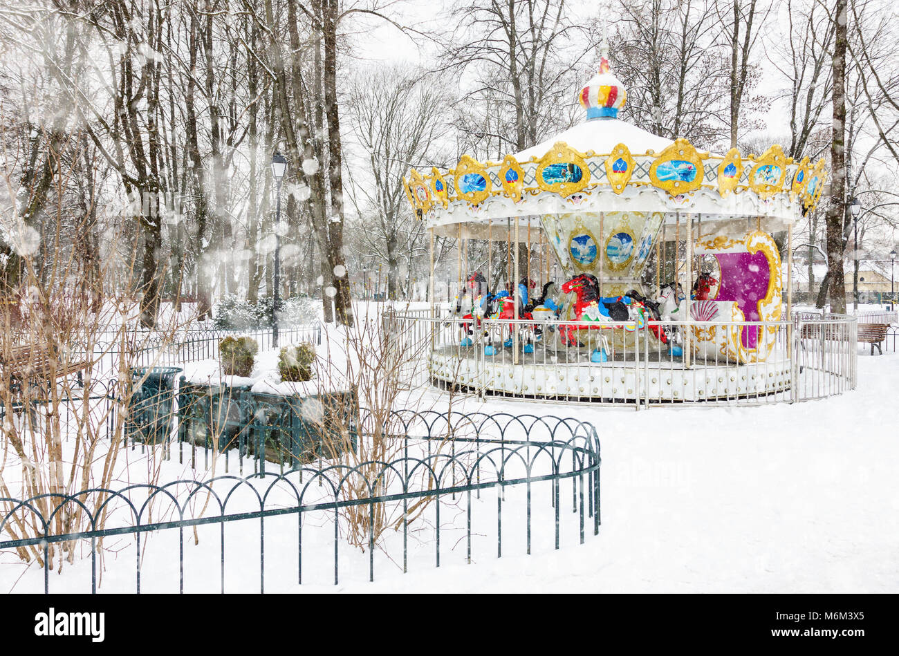 Colorful empty vintage carousel in the park on snowy winter day Stock ...