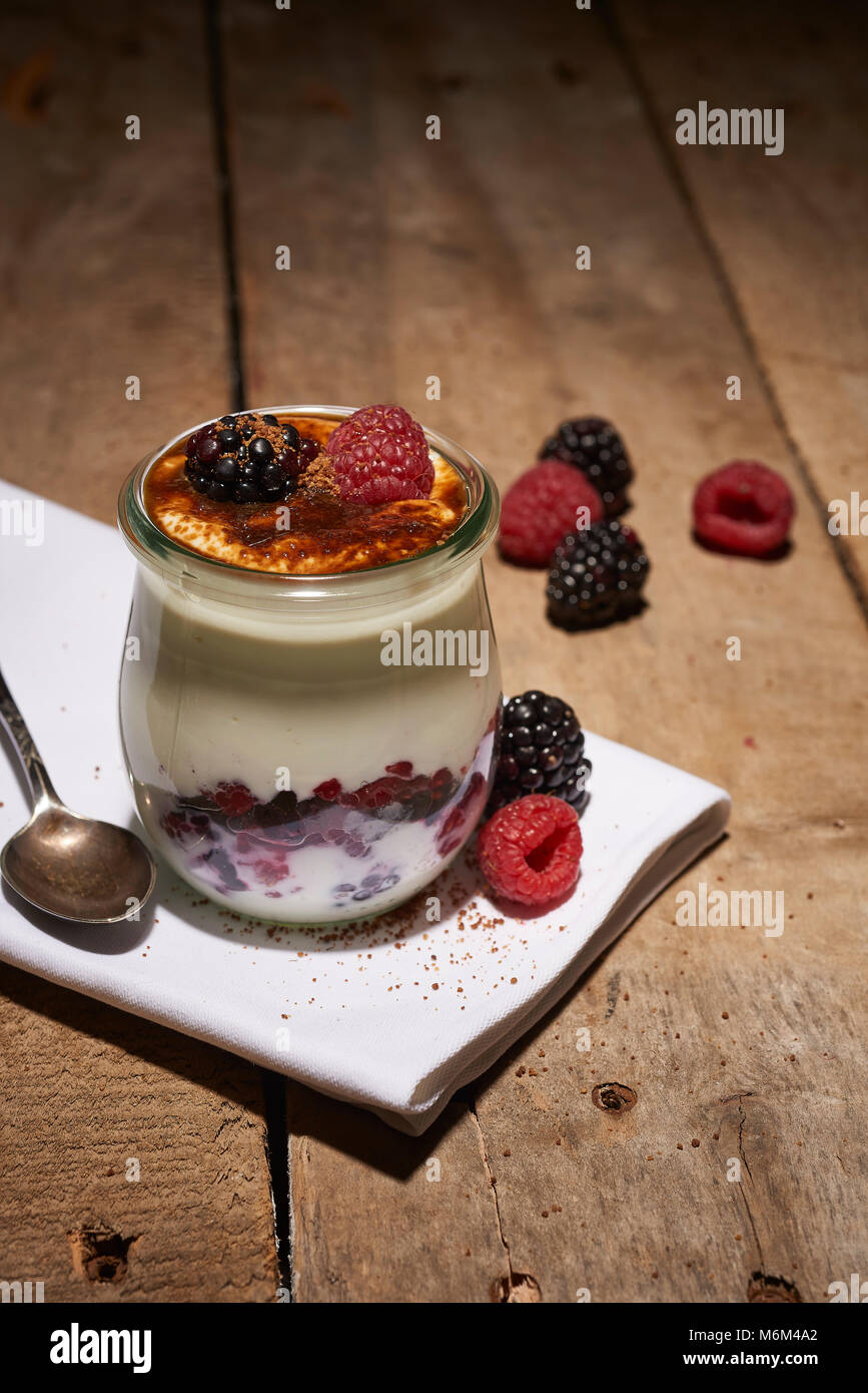delicious and fresh made dessert with brambles and raspberries Stock ...