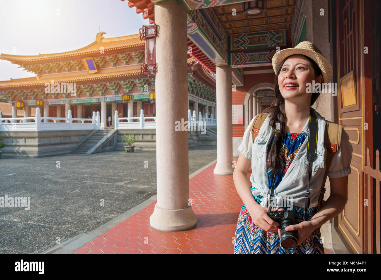China summer travel. Beautiful Asian woman tourist relaxing looking at ...