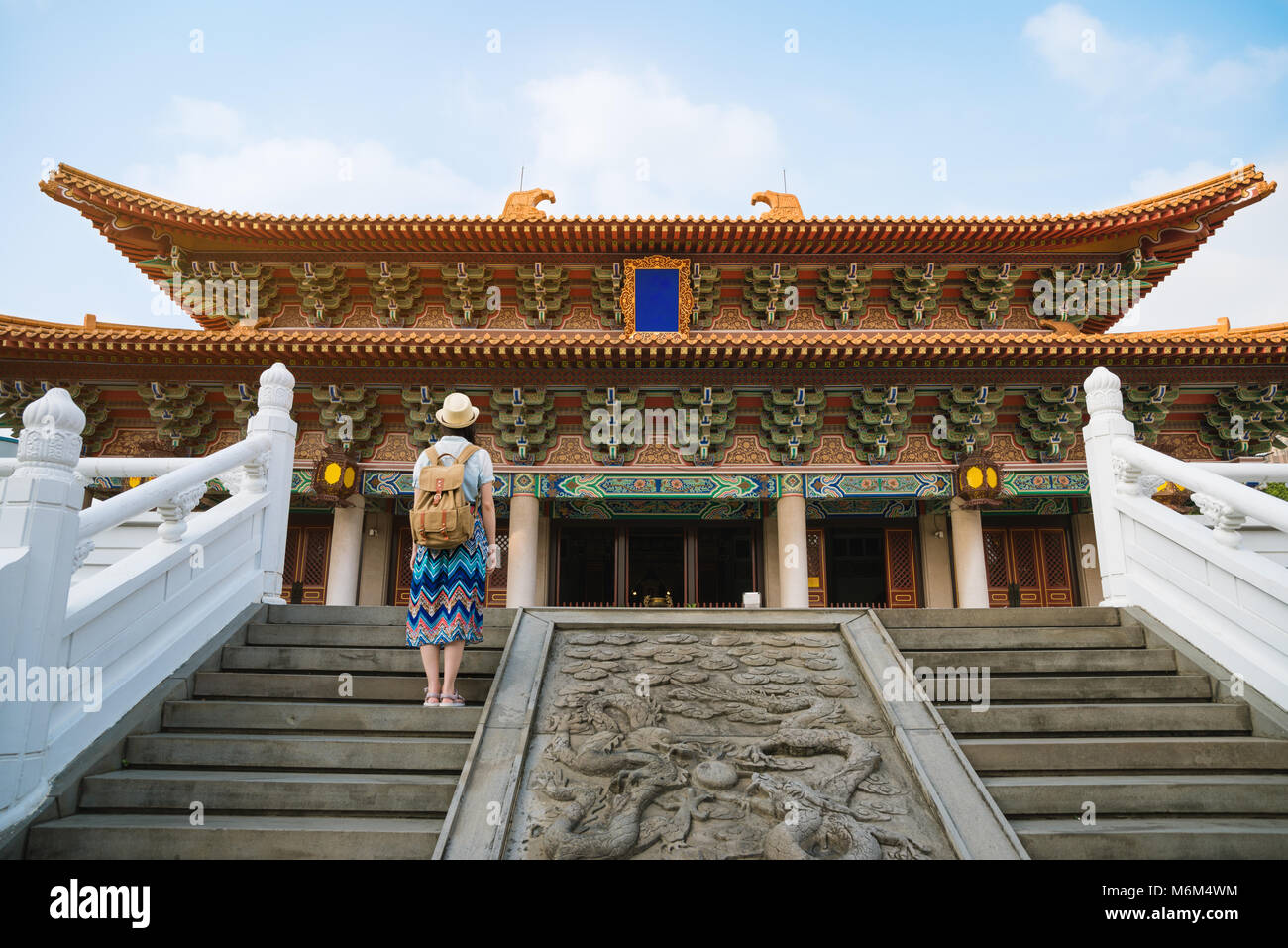 rear view of Chinese woman looking at the old traditional temple in ...