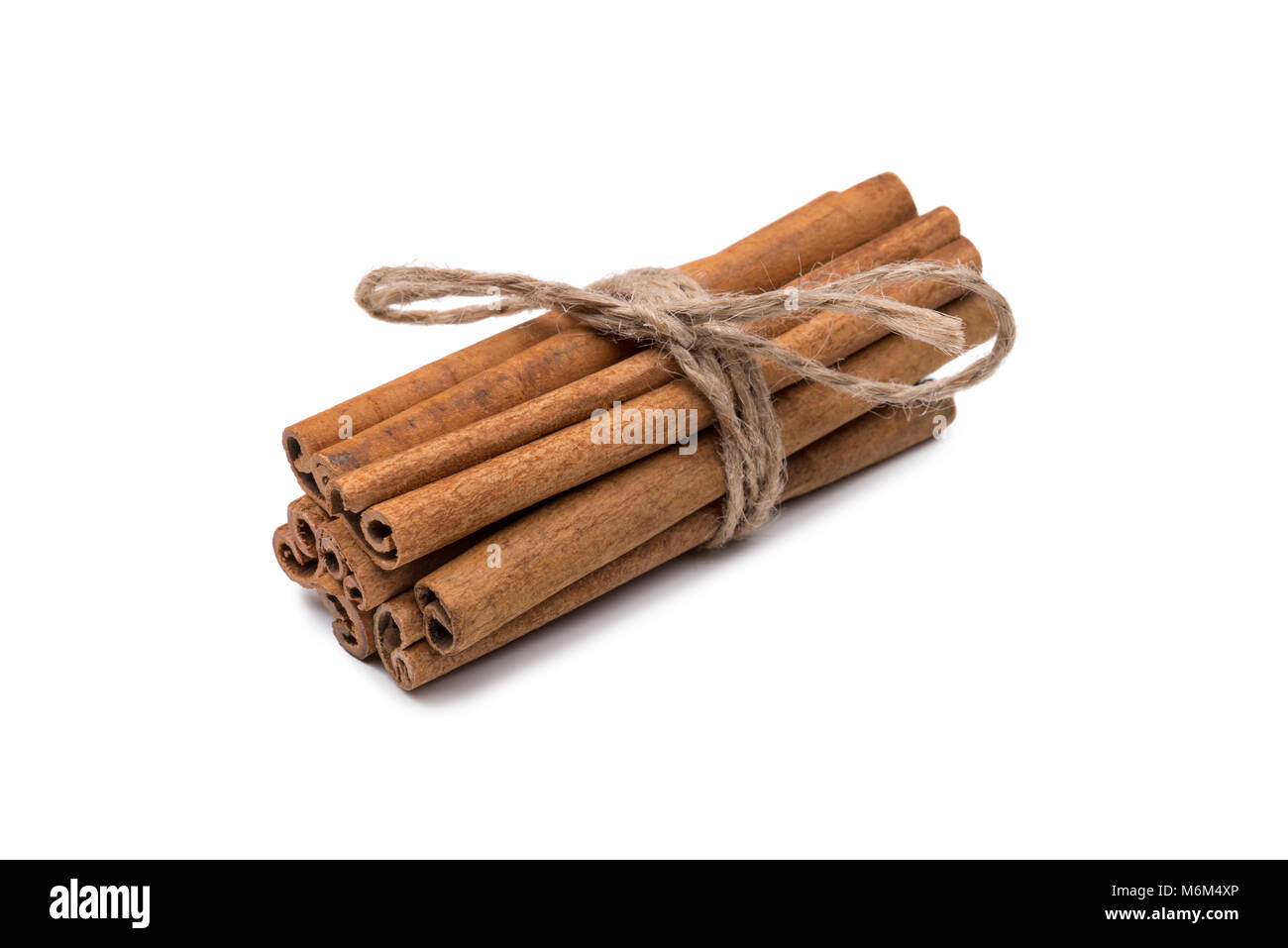 Cinnamon sticks spice tied with a rope, isolated on white background ...