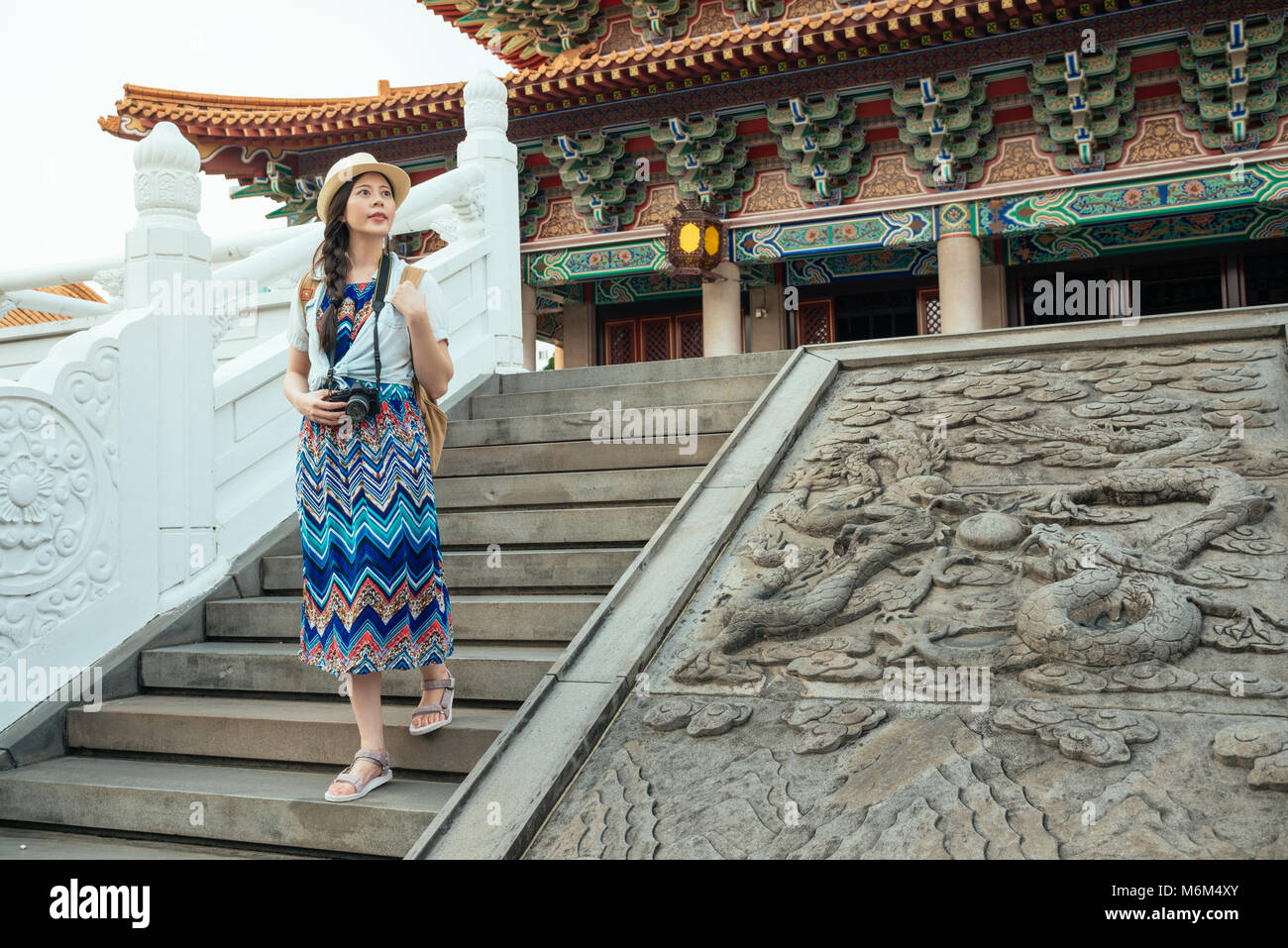 Beautiful woman walking on traditional chinese stair at ancient ...