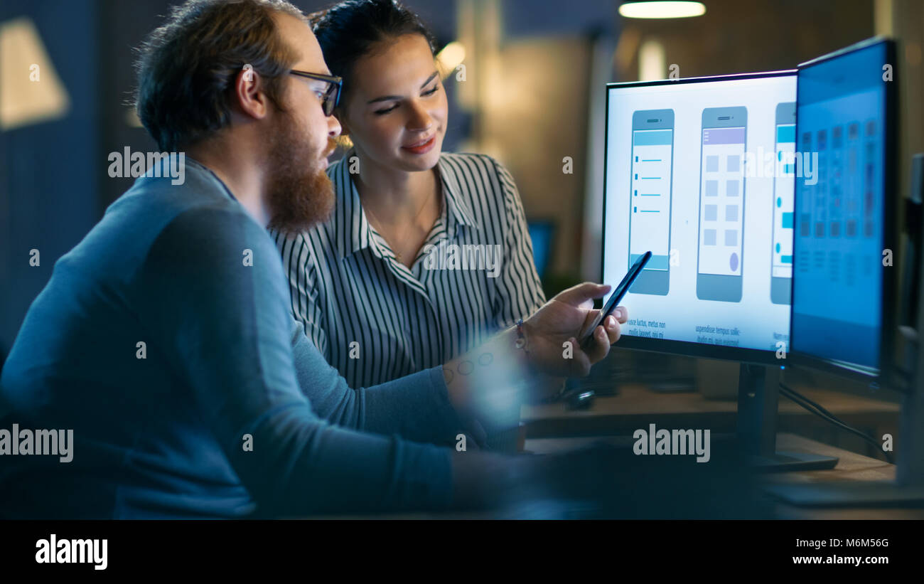 Handsome Male and Beautiful Female Mobile Application Designers Test ...