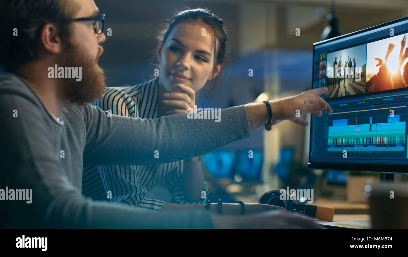 Female and Male Video Editors Work With Footage and Sound on Their ...