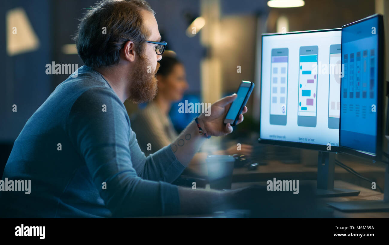 Professional Statistician Works with Graphics on His Personal Computer ...