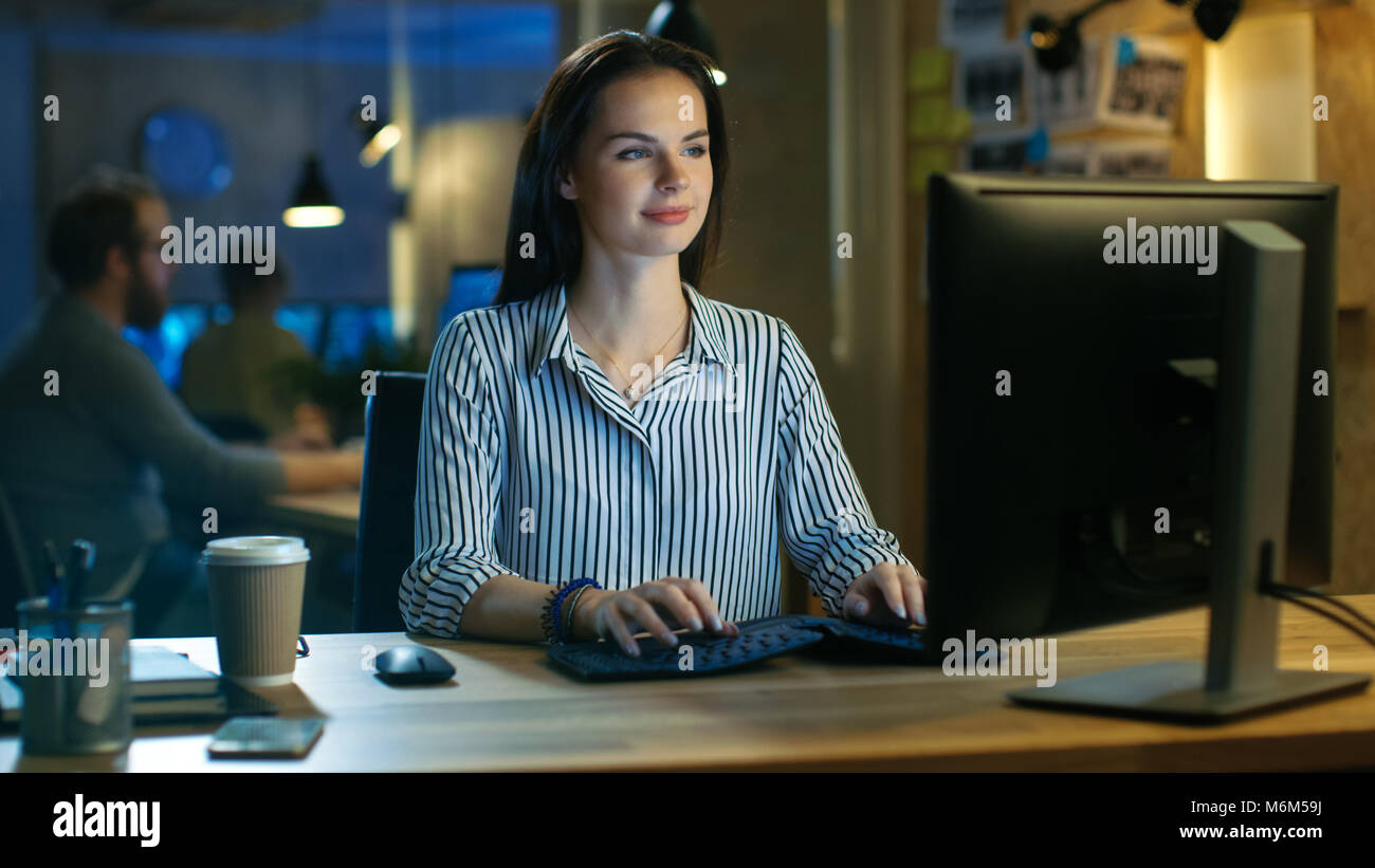 Young woman works on the computer hi-res stock photography and images ...