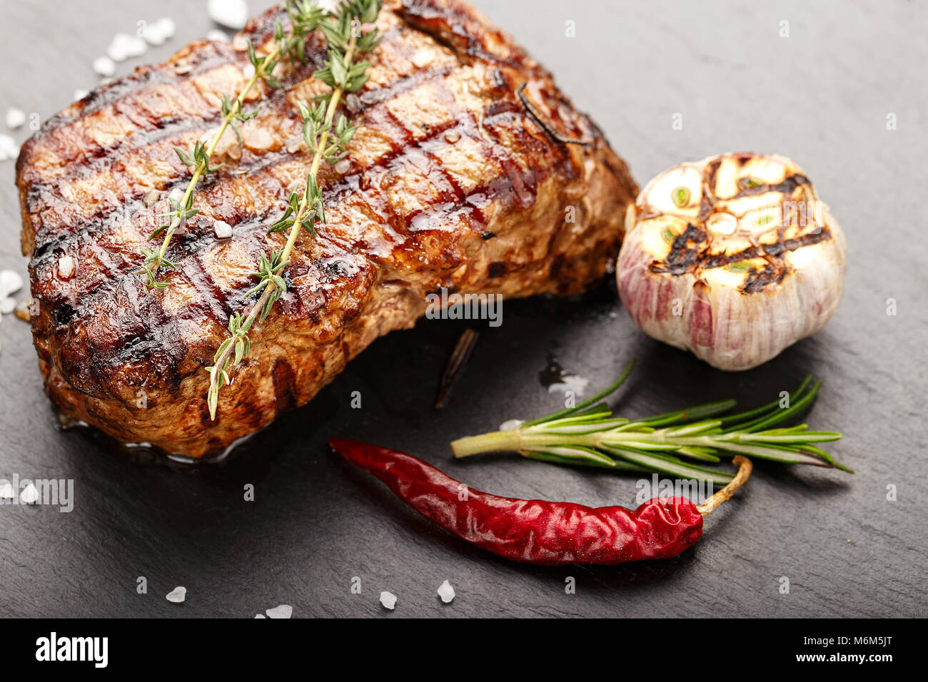 Cooked steak marble grilled meat with spices. Photo for menu, space for ...