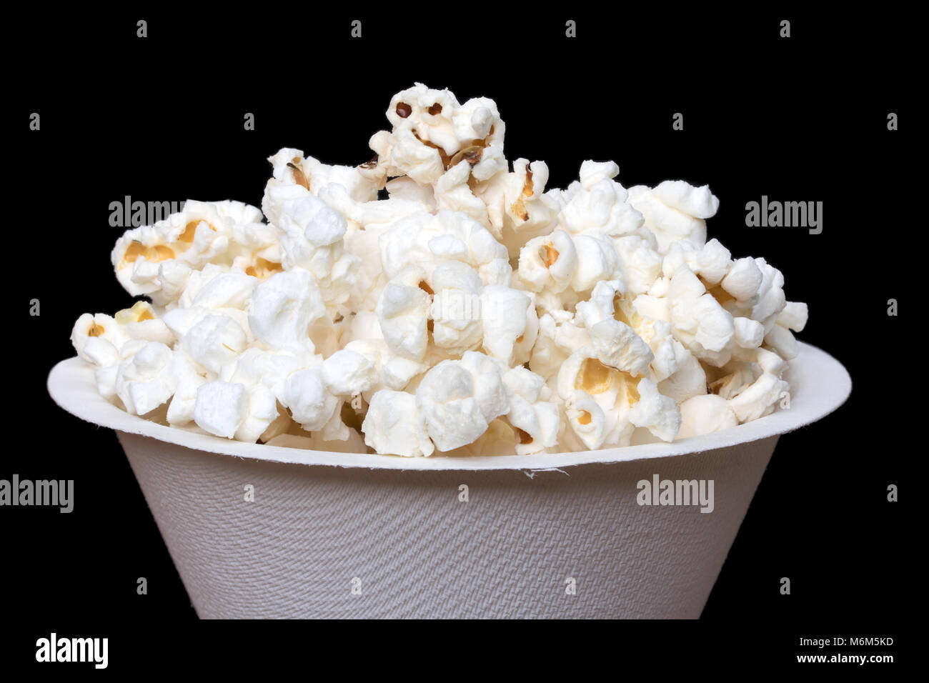 Popcorn in white bucket on black background, macro view Stock Photo - Alamy