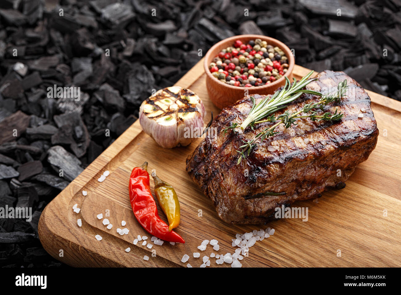 Cooked steak marble grilled meat Angus with spices on the coal. Photo ...