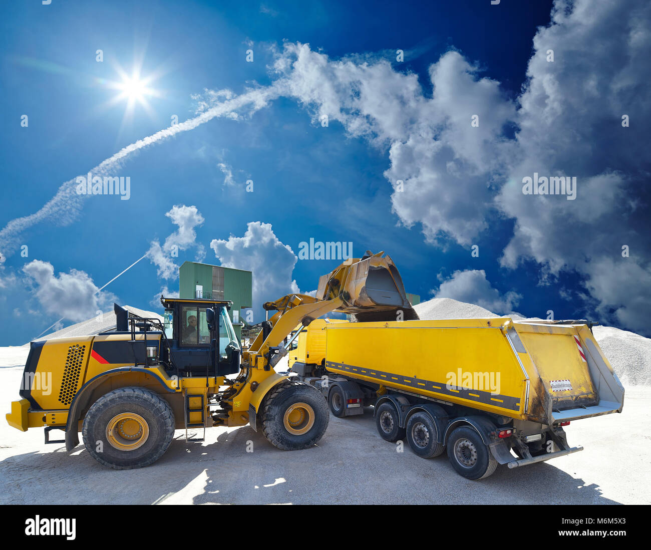 Loader excavator loads ground in hi-res stock photography and images ...