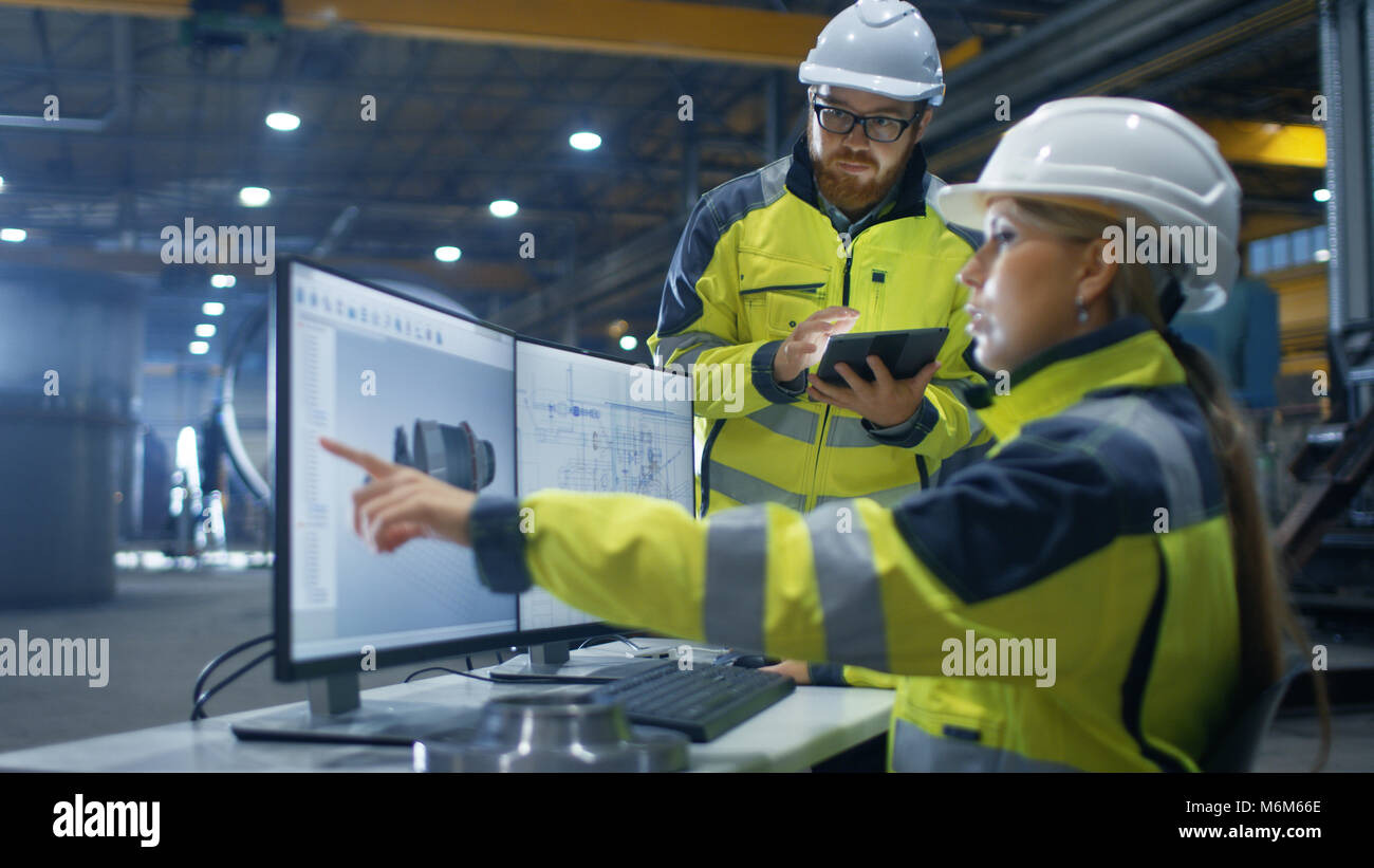 Inside the Heavy Industry Factory Female Industrial Engineer Works on ...