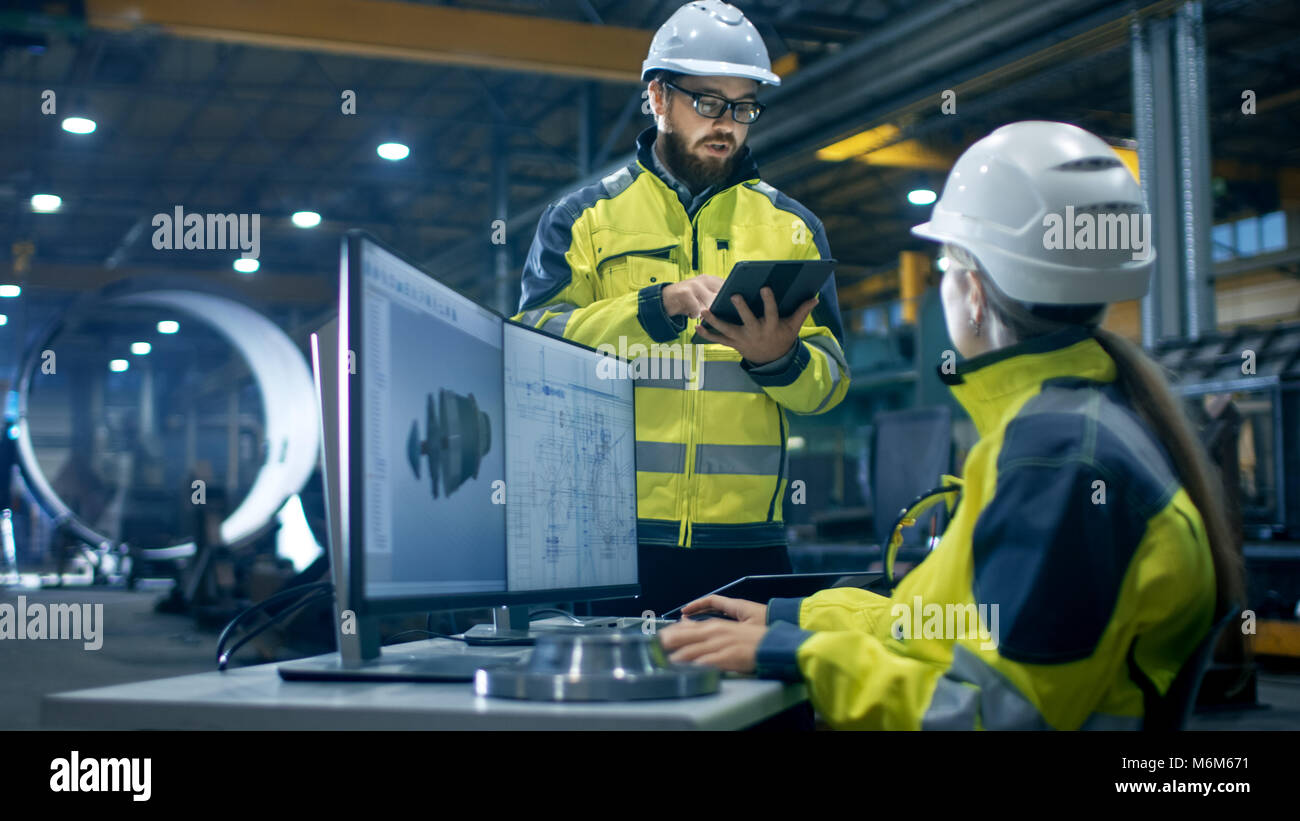 Inside the Heavy Industry Factory Female Industrial Engineer Works on ...