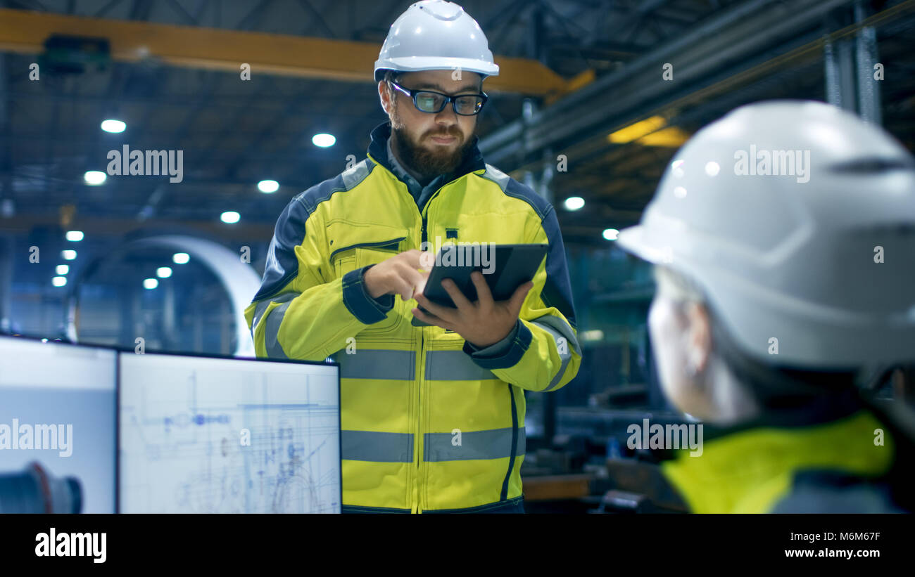 Inside the Heavy Industry Factory Female Industrial Engineer Works on ...