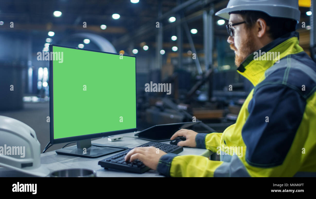 Inside the Heavy Industry Factory Industrial Engineer Works on the ...