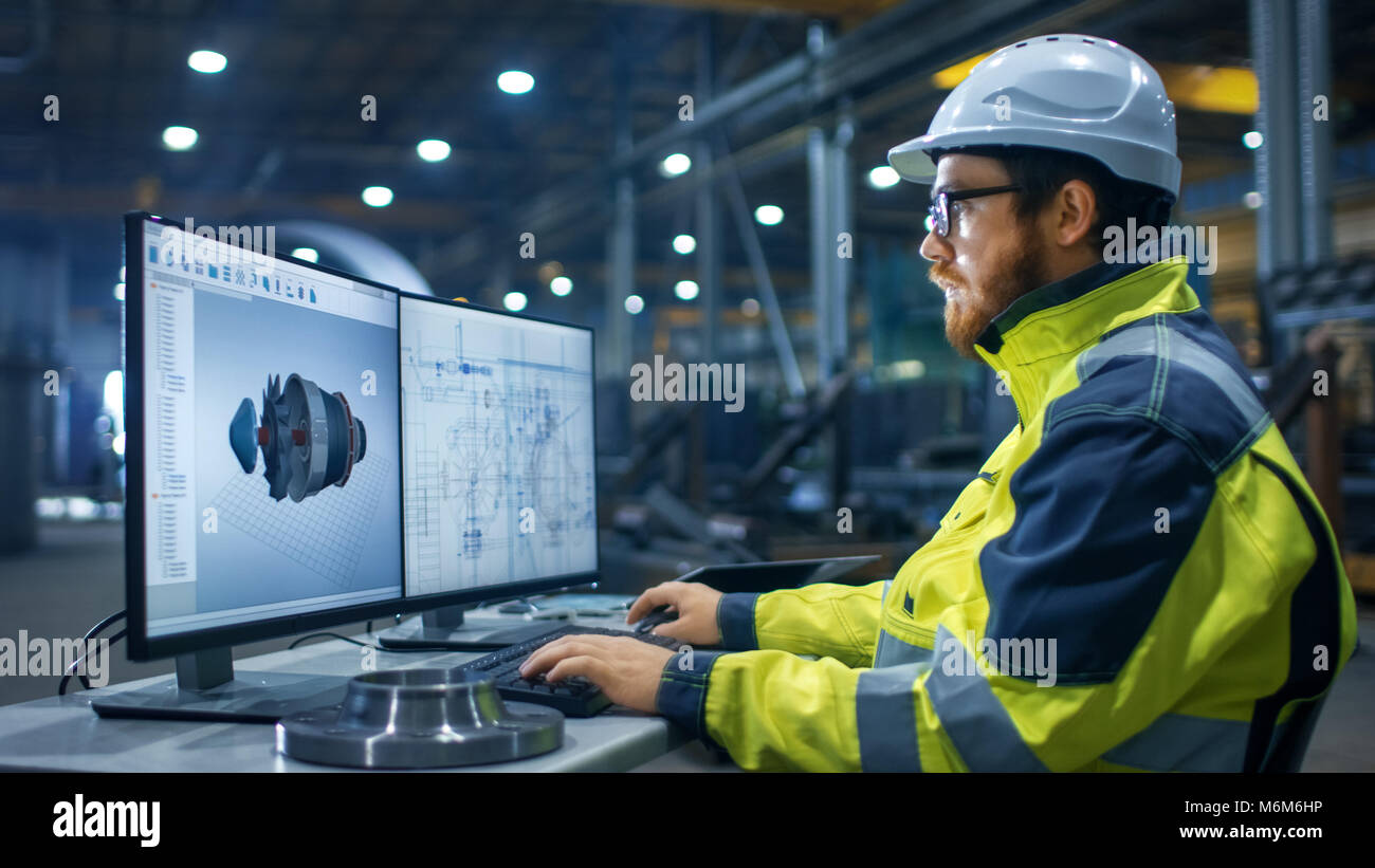 Inside the Heavy Industry Factory Industrial Engineer Works on the ...