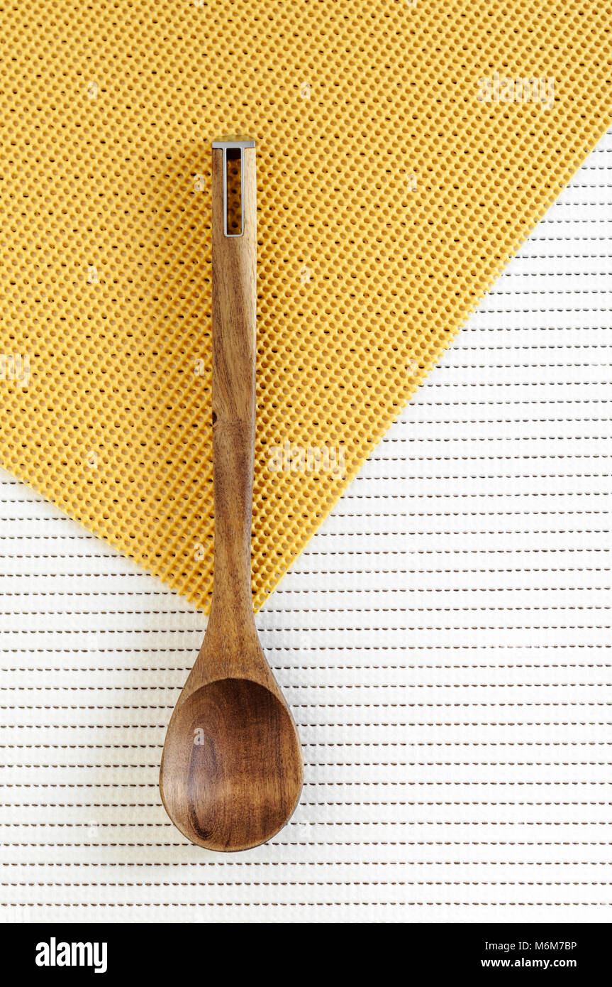 Large wood serving spoon on bright modern geometric background Stock ...