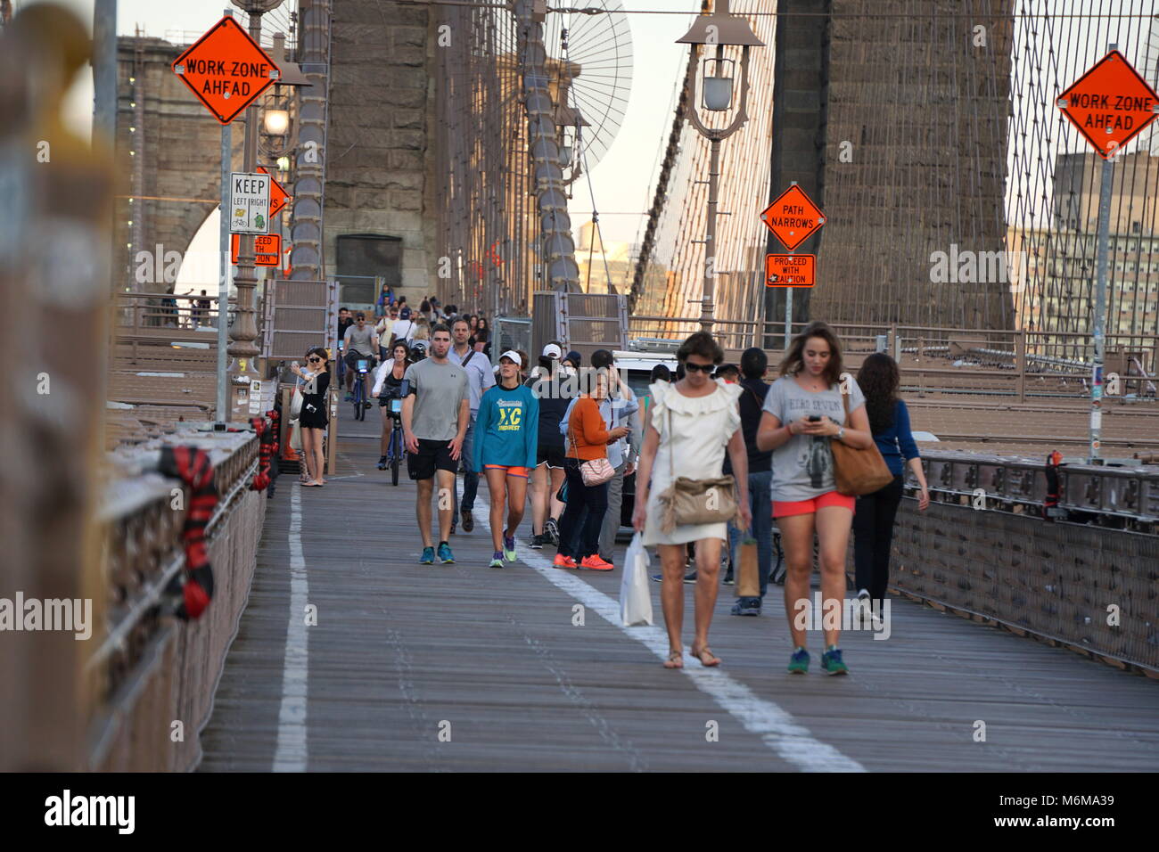 New York City, NY - June 7, 2016: Tourists visiting Manhattan walk ...
