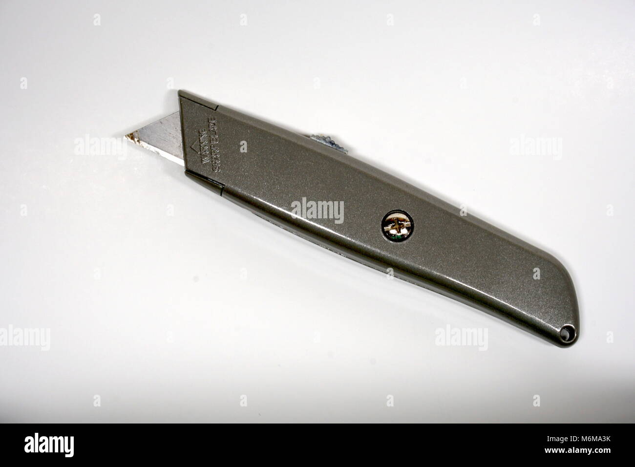 Isolated razor blade utility knife cutting tool against white ...