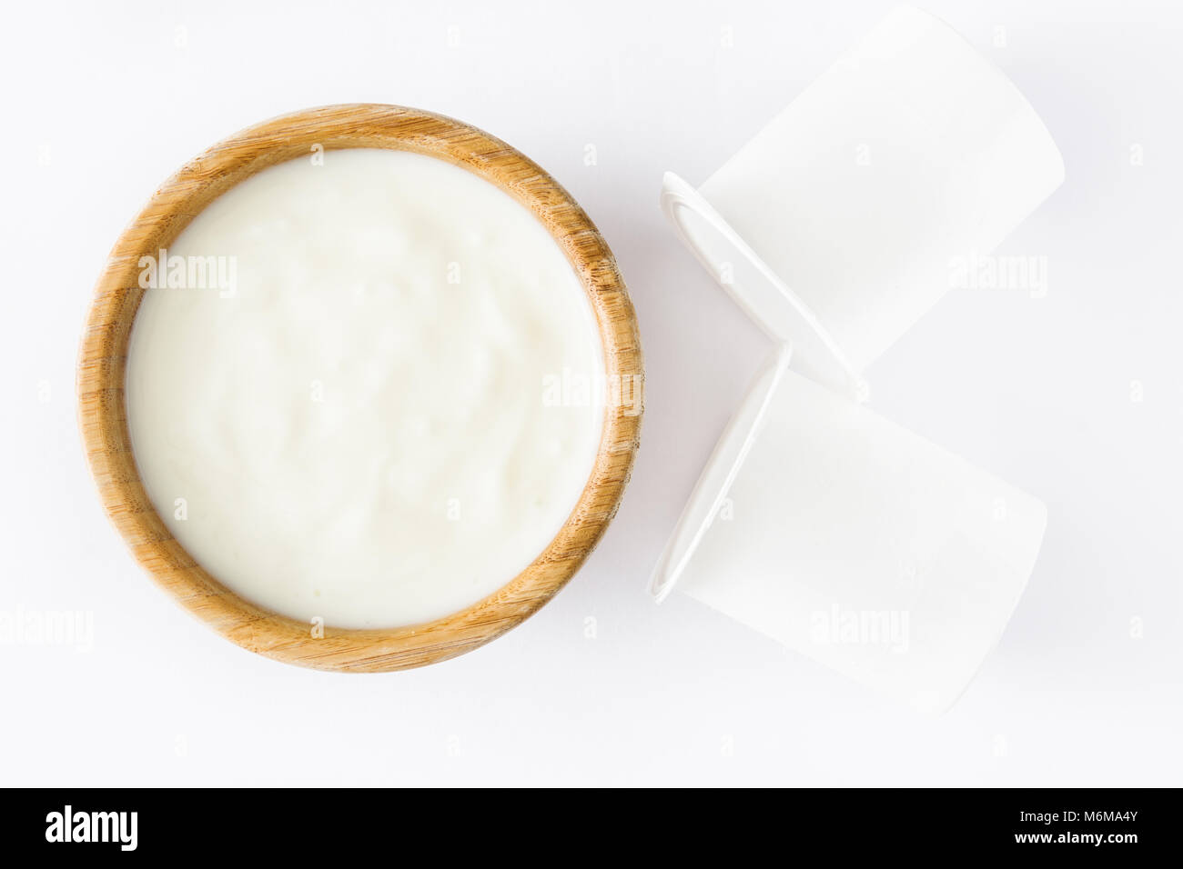Natural yogurt in wooden bowl isolated on white background Stock Photo ...