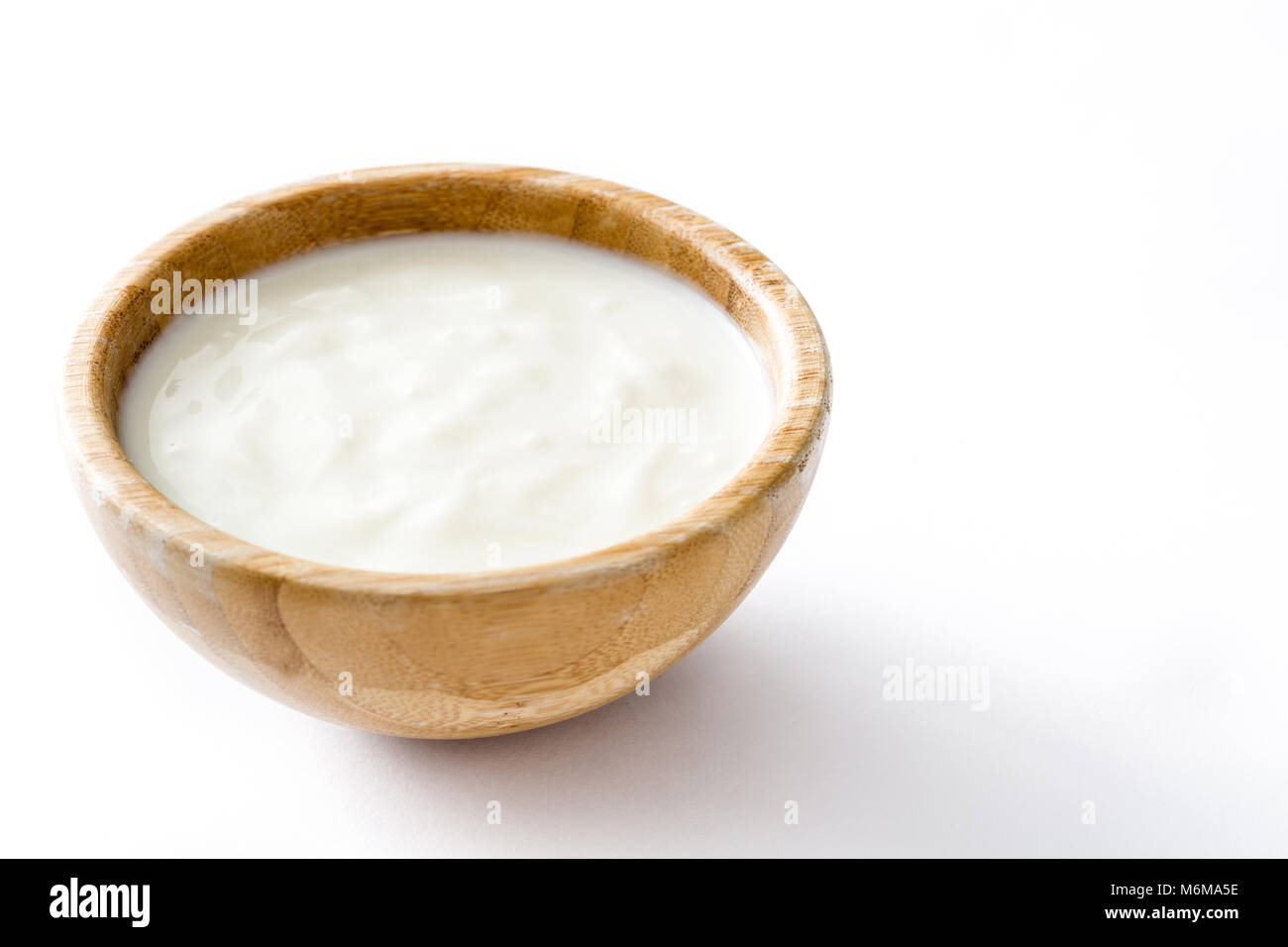 Natural yogurt in wooden bowl isolated on white background Stock Photo ...