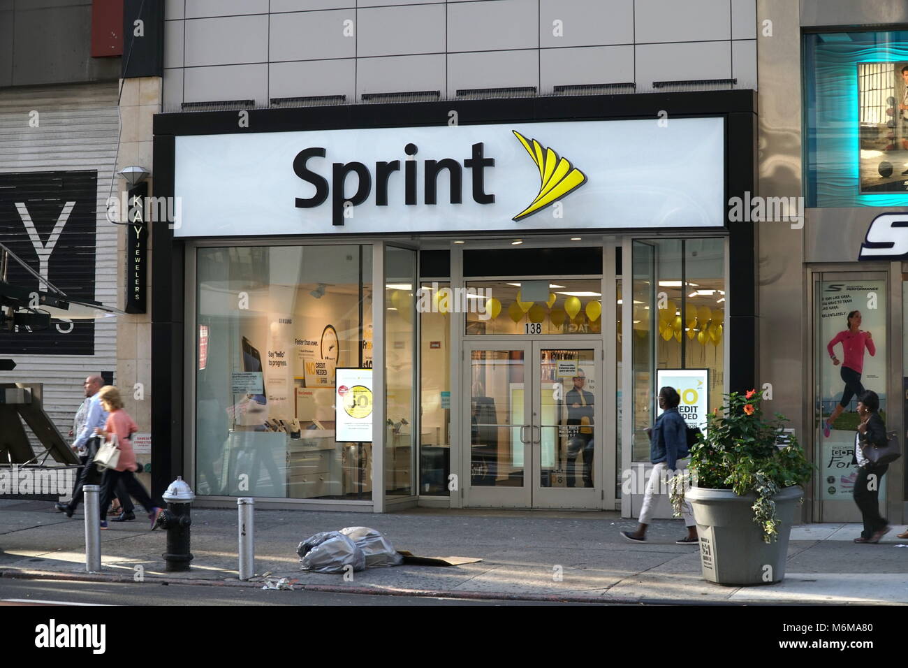 New York City - September 2016: People walk past Sprint store in ...