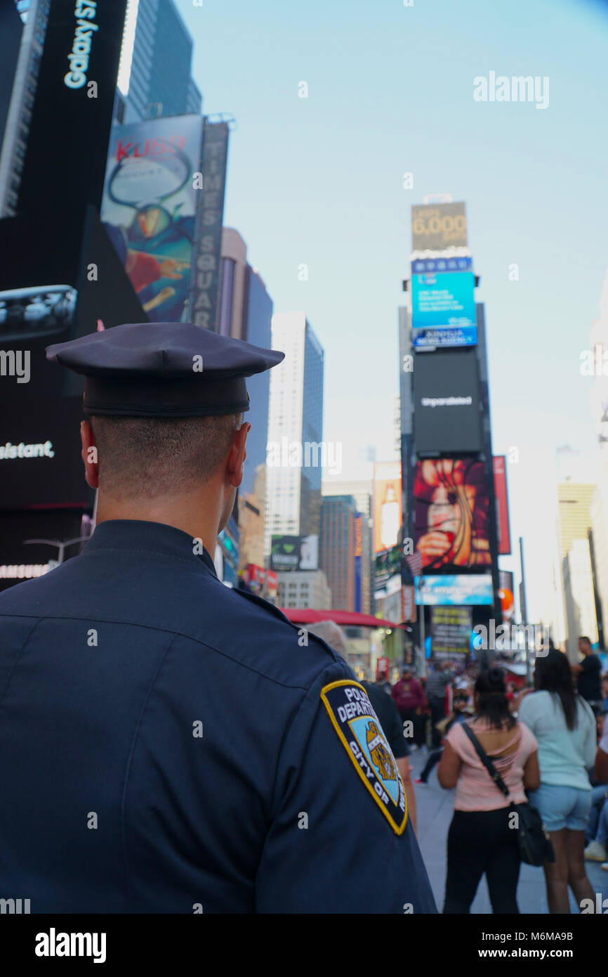 New York City - September 2016: NYPD police officer stands proud in ...