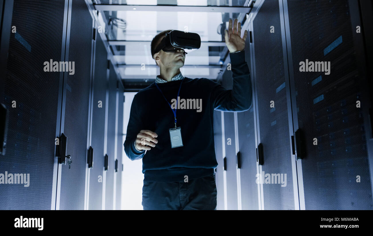 IT Engineer Wearing Virtual Reality Headset Works with Augmented ...